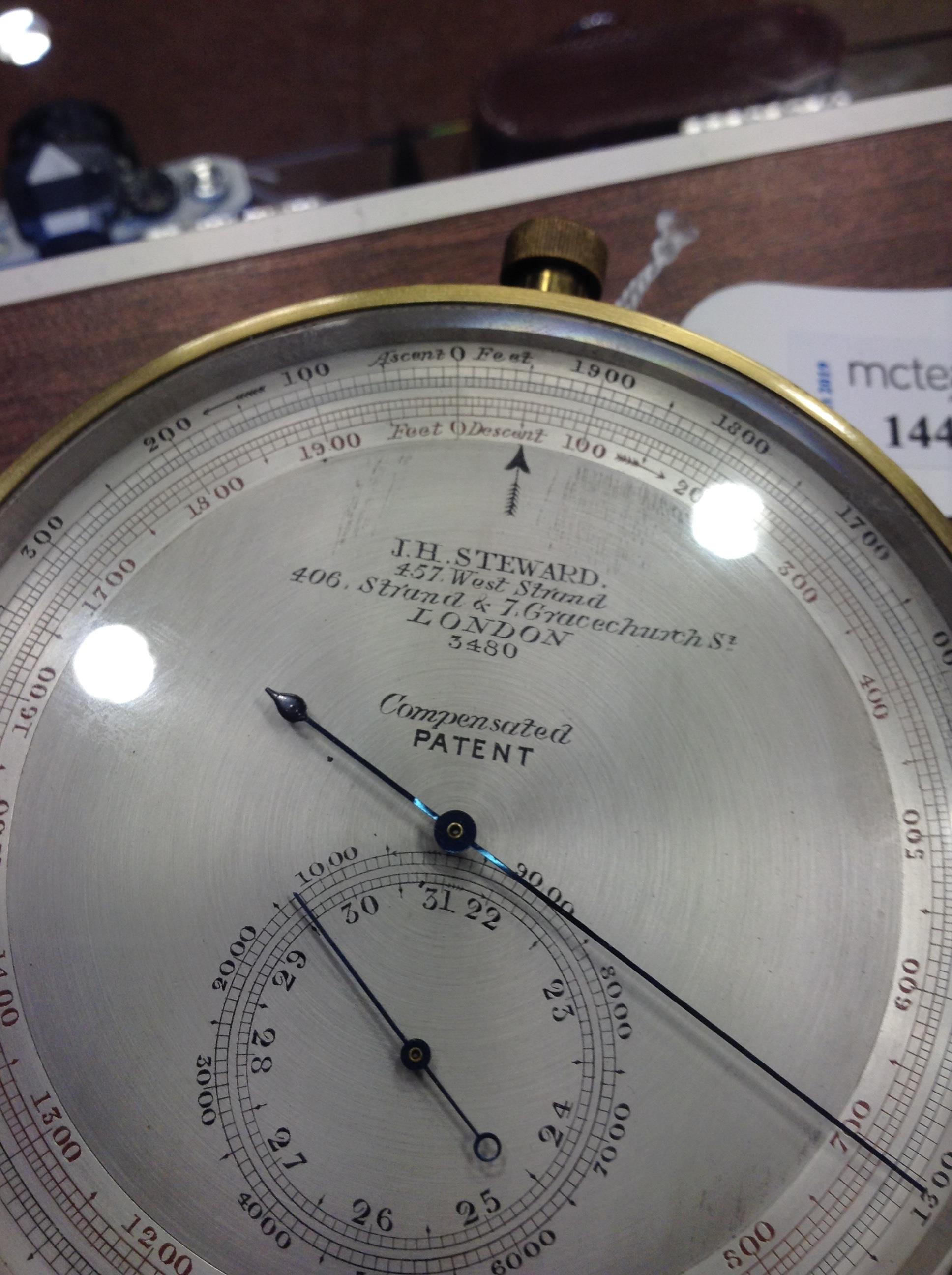 Lot 1443 - A BRASS CASED ANEROID ALTIMETER BY J. H.