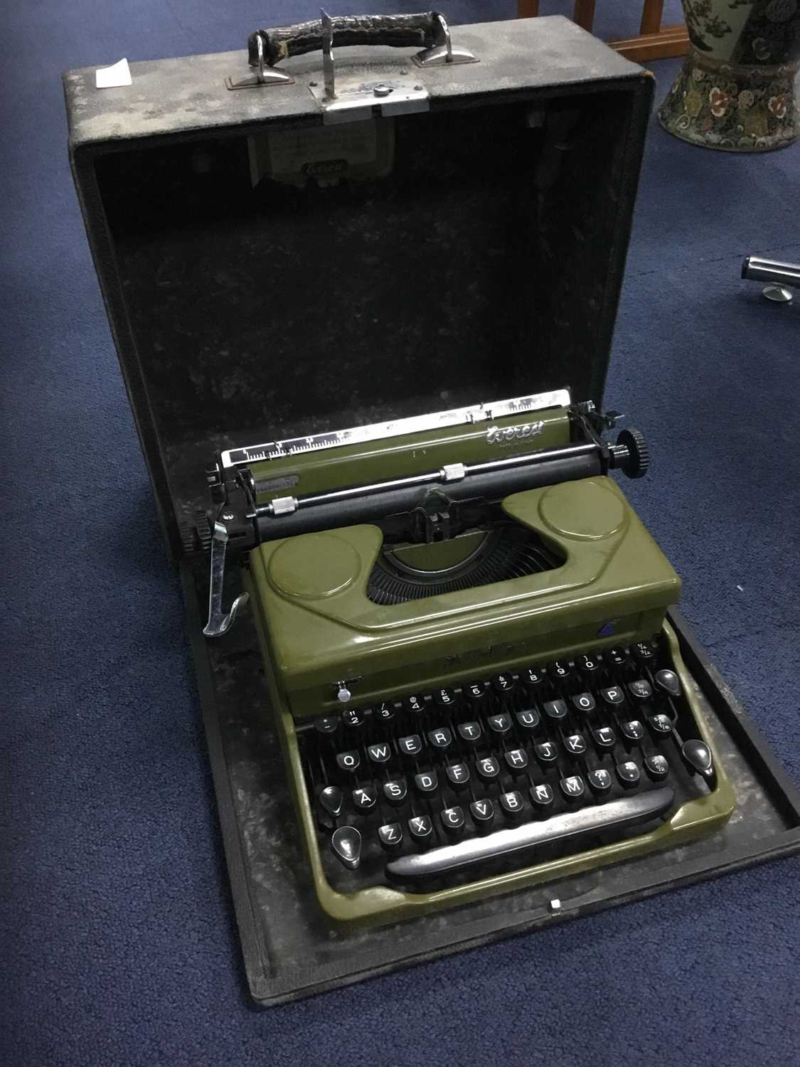 Lot 100 - A VINTAGE TYPEWRITER AND A CASED TAPE