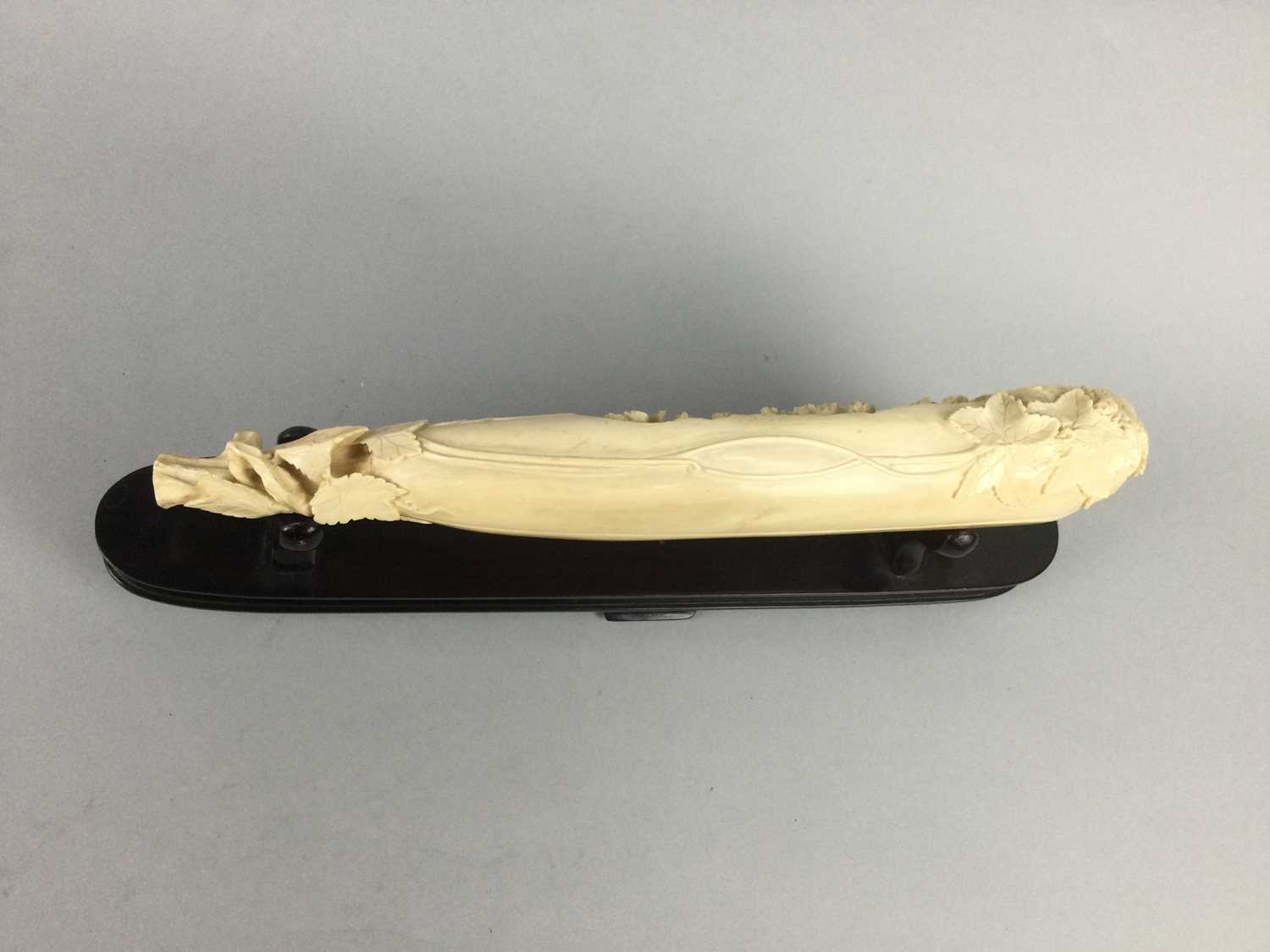 Lot 900 - A JAPANESE IVORY CARVING OF A VEGETABLE