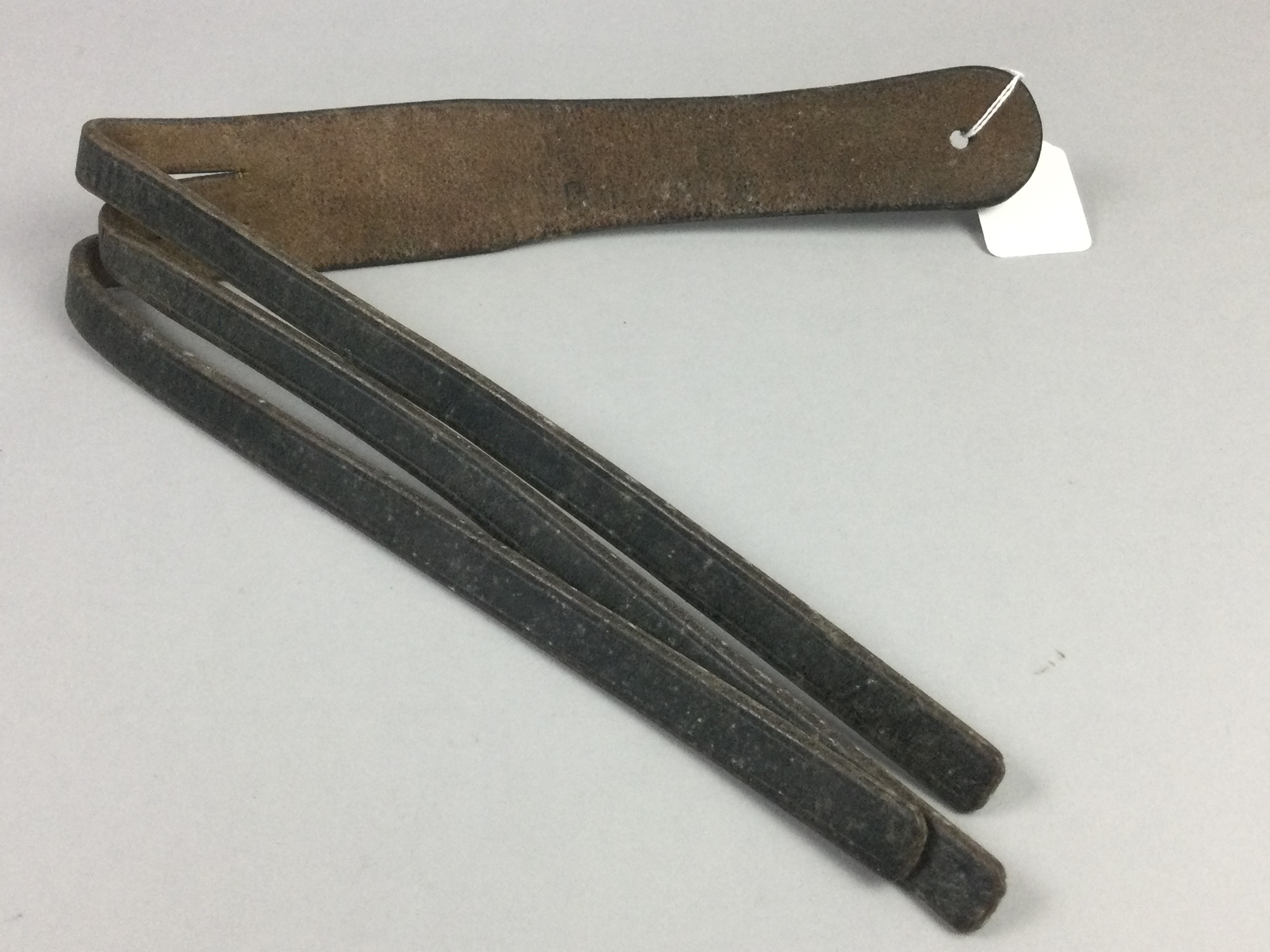Lot 389 - A LEATHER SCHOOL TAWSE ALONG WITH A MORTAR