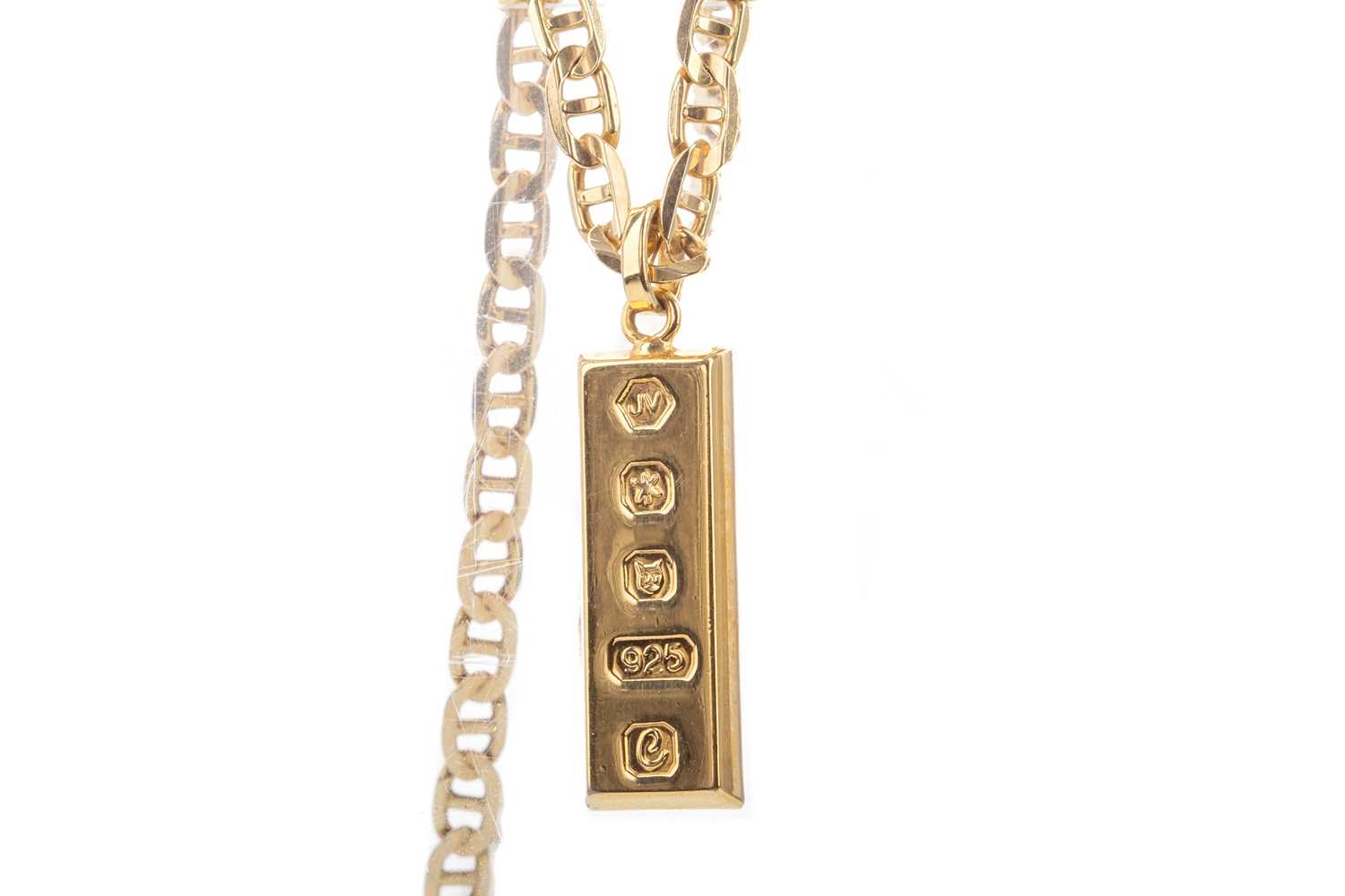 Lot 549 - A GOLD PLATED SILVER INGOT ON CHAIN