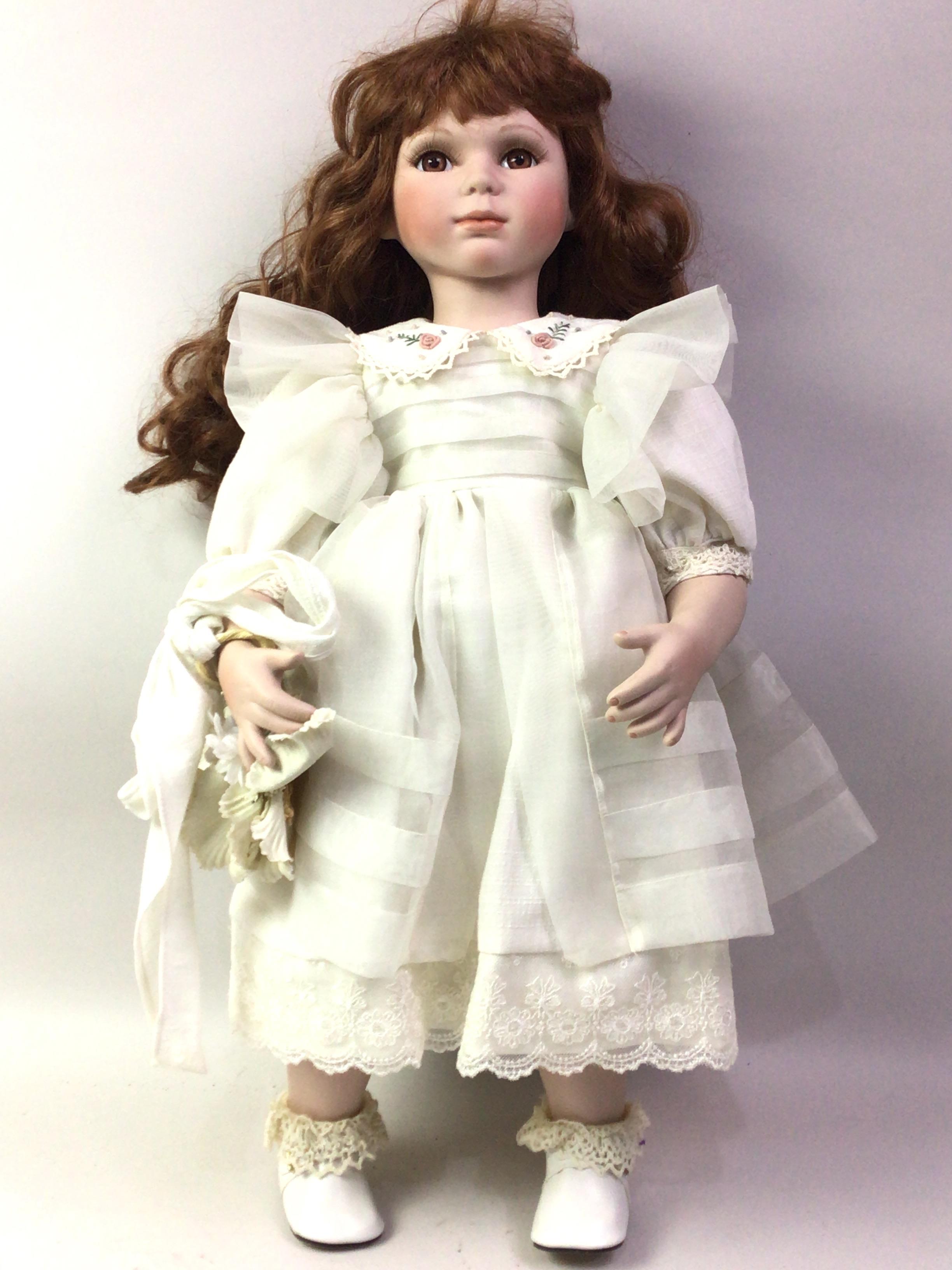 Lot 61 - TWO LARGE PORCELAIN DOLLS,
