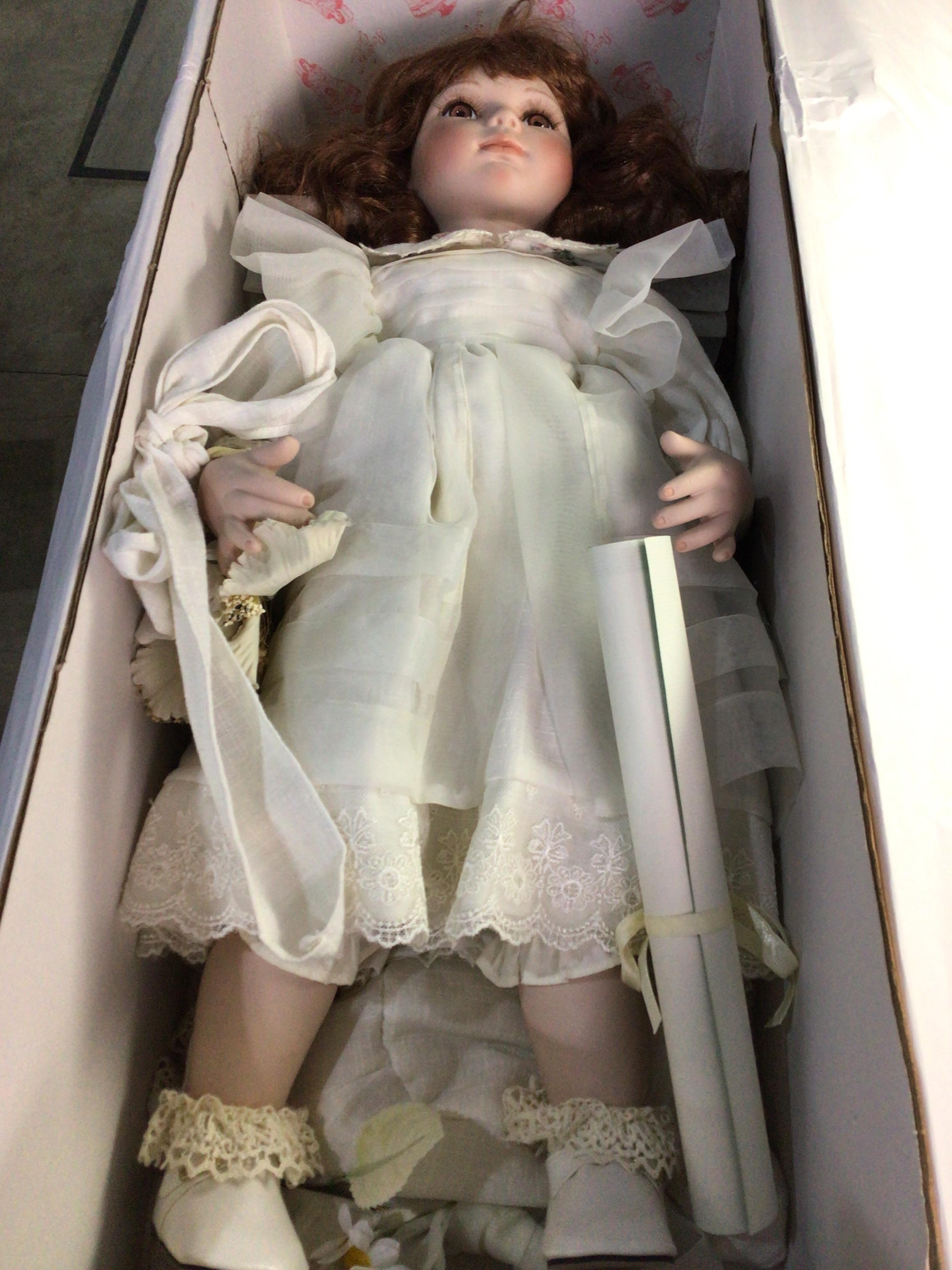 Lot 61 - TWO LARGE PORCELAIN DOLLS,