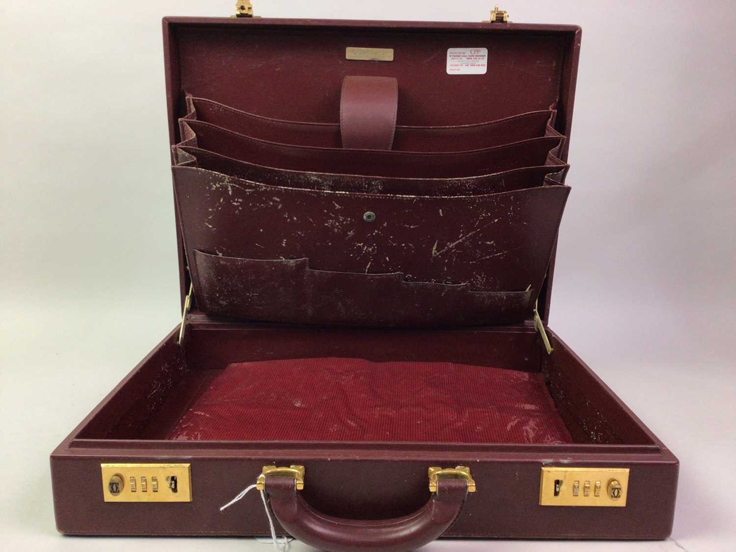 Lot 544 - BURGUNDY BRIEFCASE, WITH CARTIER EMBLEM
