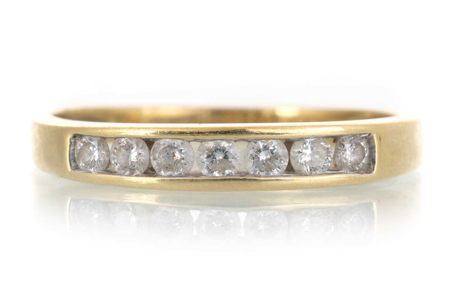 Lot 710 - DIAMOND SEVEN STONE RING,